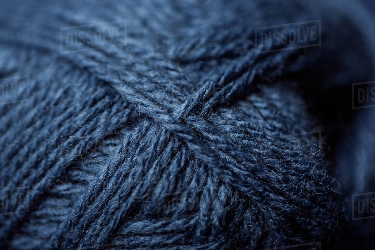 Full frame of blue yarn texture as background - Stock Photo - Dissolve