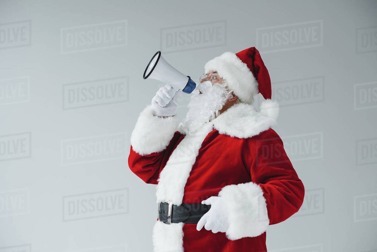 side view of santa claus using megaphone isolated on white - Royalty ...