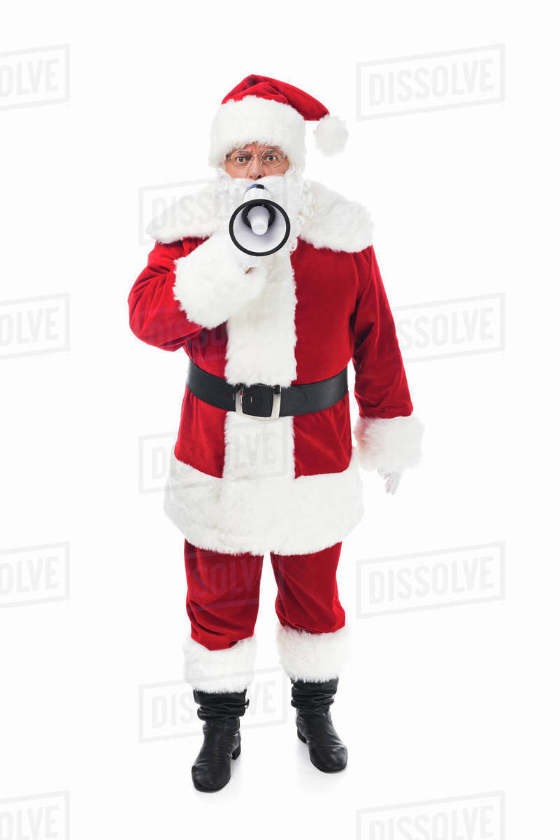 full length view of santa claus using megaphone and looking at camera ...