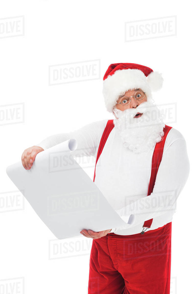 shocked santa holding wishlist and looking at camera isolated on white ...