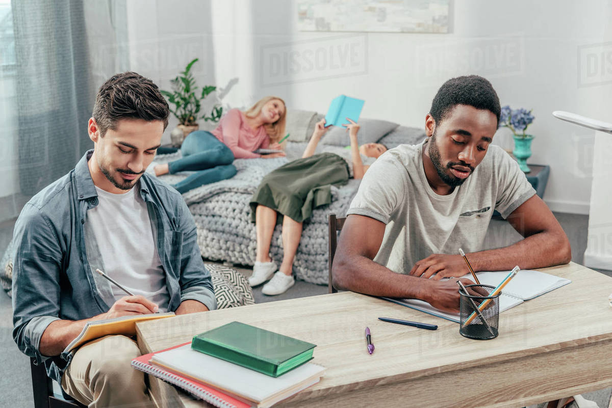 group of young students studying at home - Royalty-free Stock Photo ...