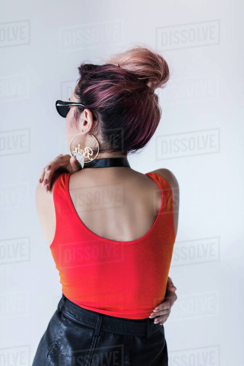 Back view of stylish girl posing for fashion shoot, isolated on white ...