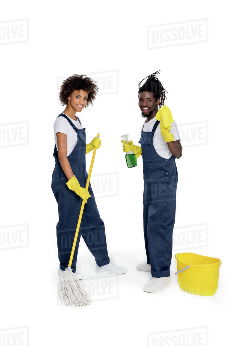 professional african american cleaners smiling at camera isolated on ...