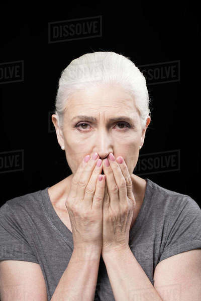 Portrait of scared grey hair woman isolated on black - Royalty-free ...