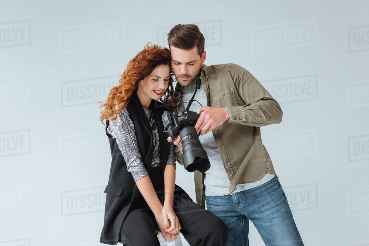 professional photographer and attractive model on fashion shoot in ...