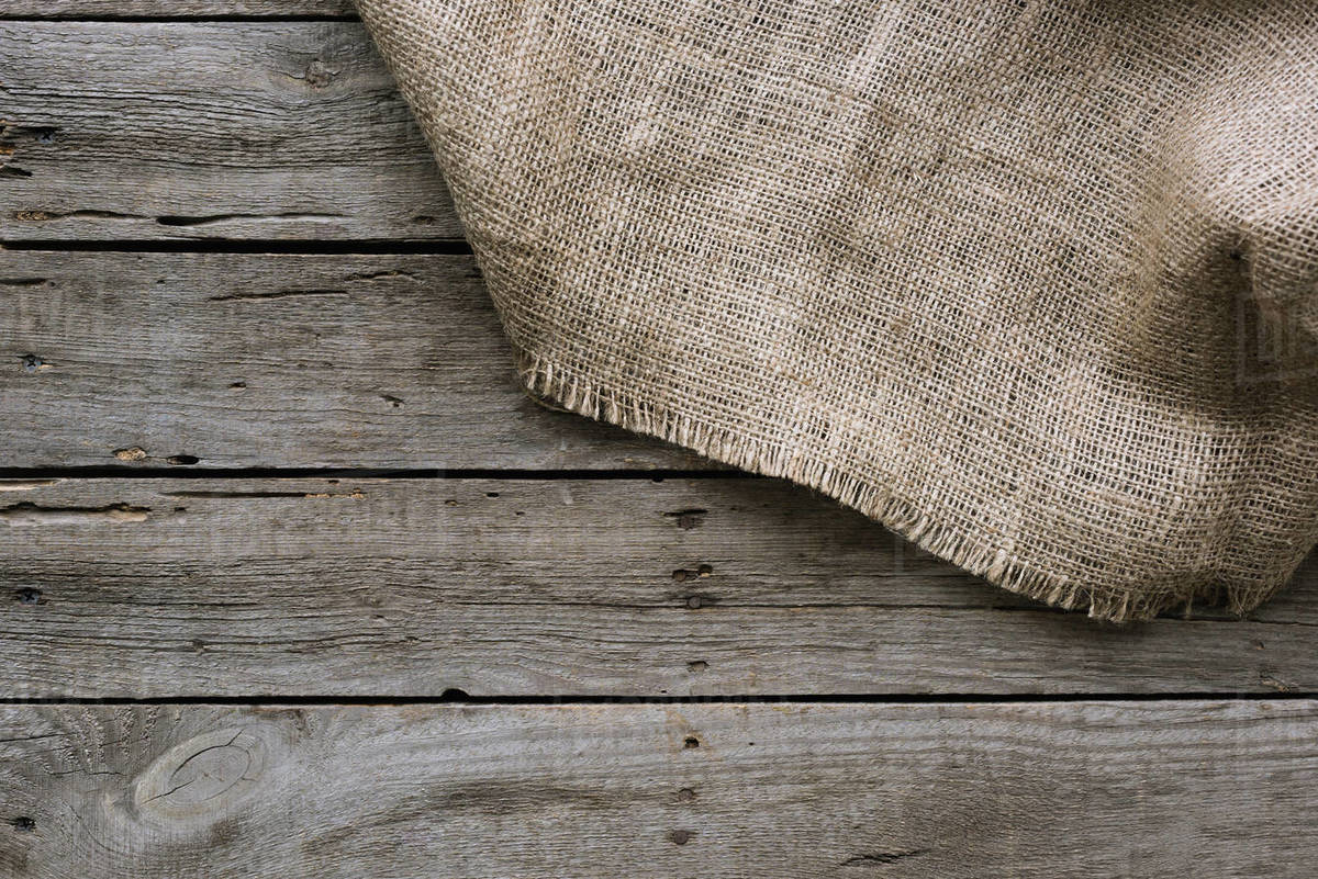 Full frame of sack clothes on wooden surface - Royalty-free Stock Photo ...