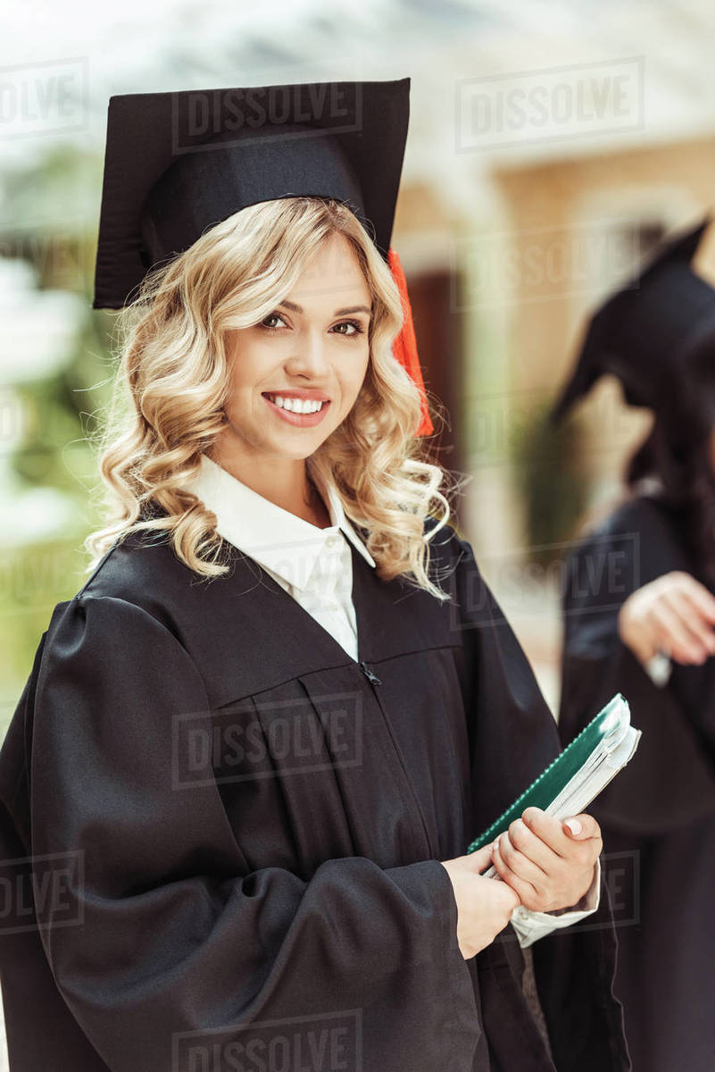 beautiful young graduated student girl with notebook - Stock Photo ...