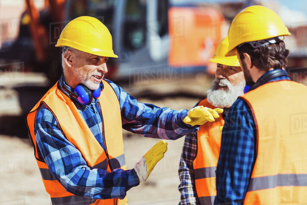 Foreman Explaining Builders Work Process At The Construction Site 