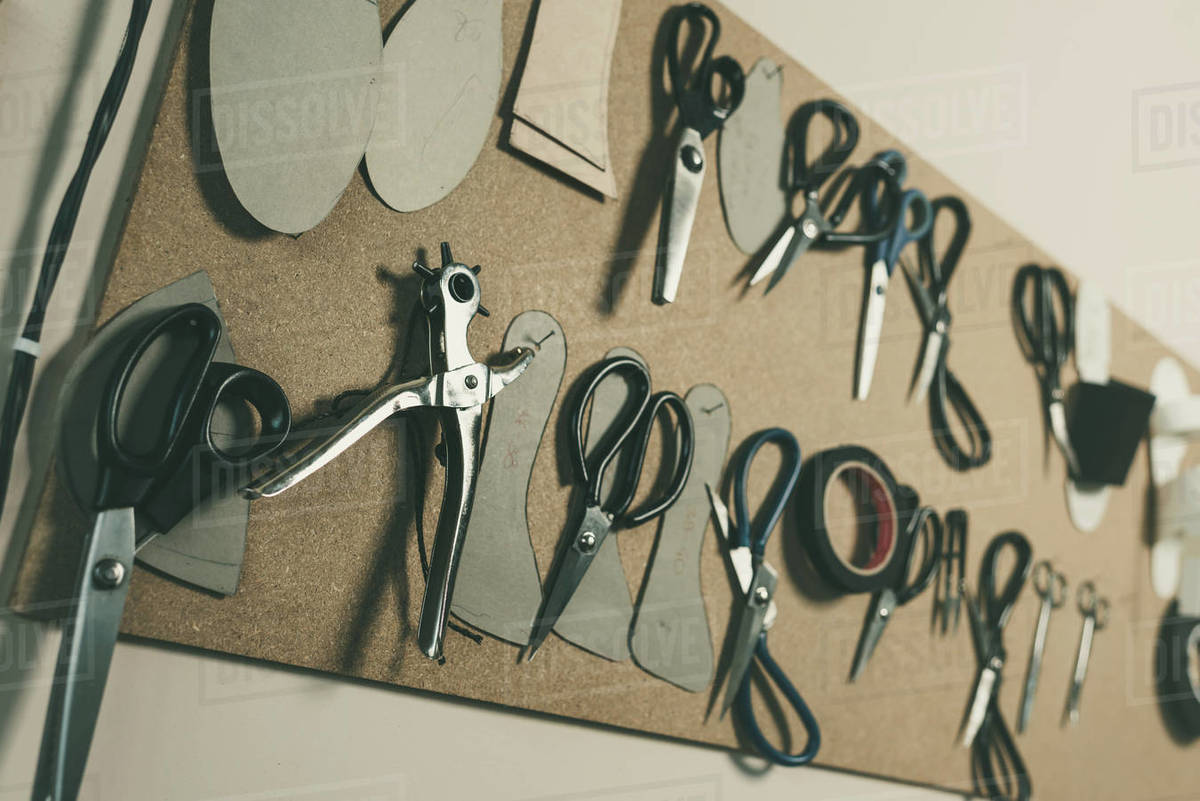 Various scissors hanging on board at shoemaker workshop - Royalty-free ...