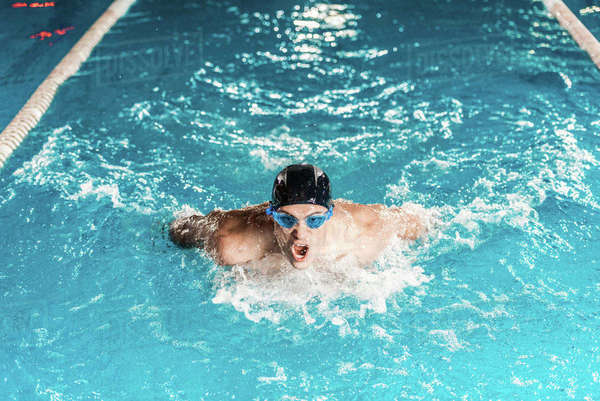 Young professional swimmer in competition swimming pool - Royalty-free ...
