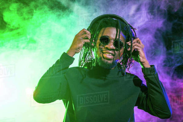 Professional African American club dj in headphones in nightclub ...