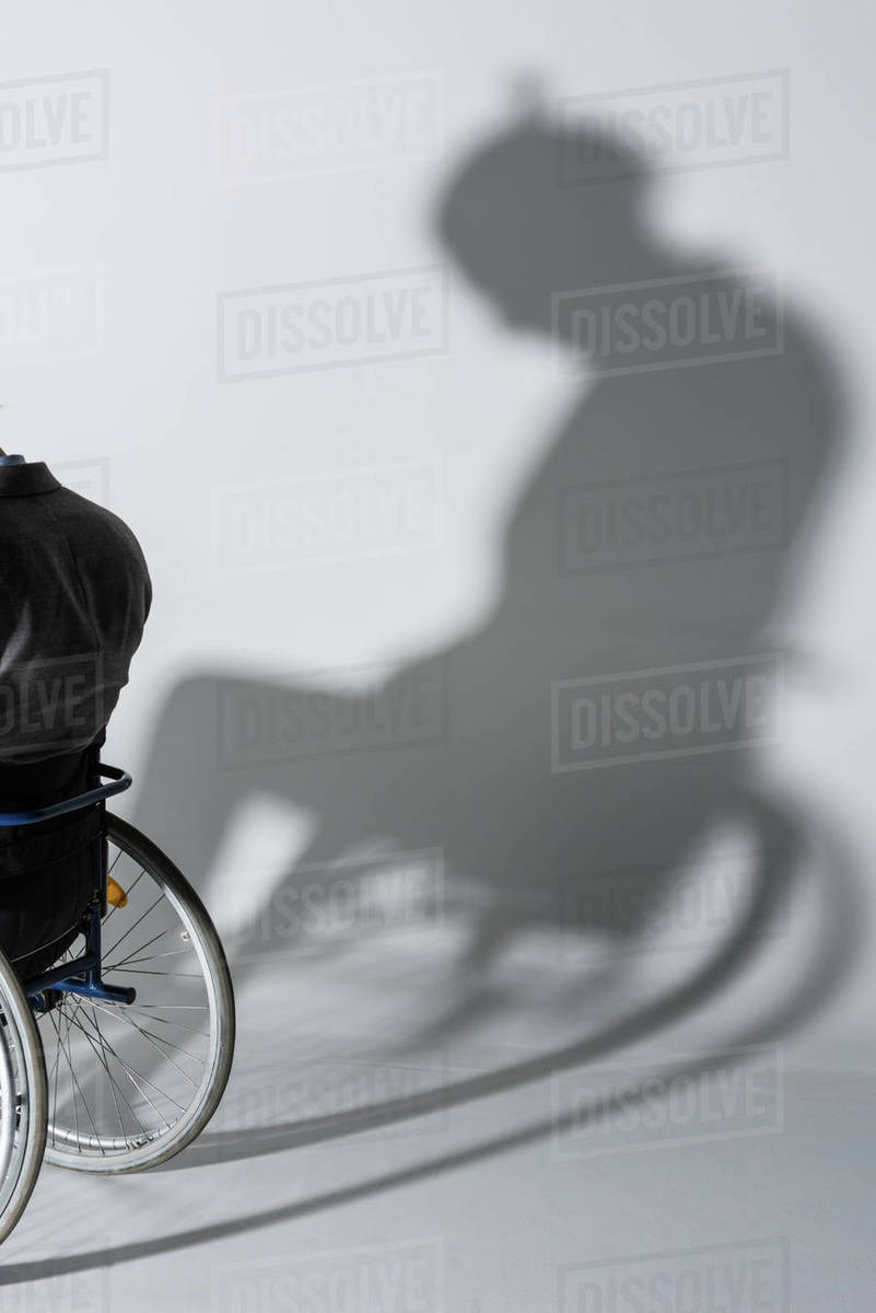 Cropped shot of physically handicapped man in wheelchair with his ...