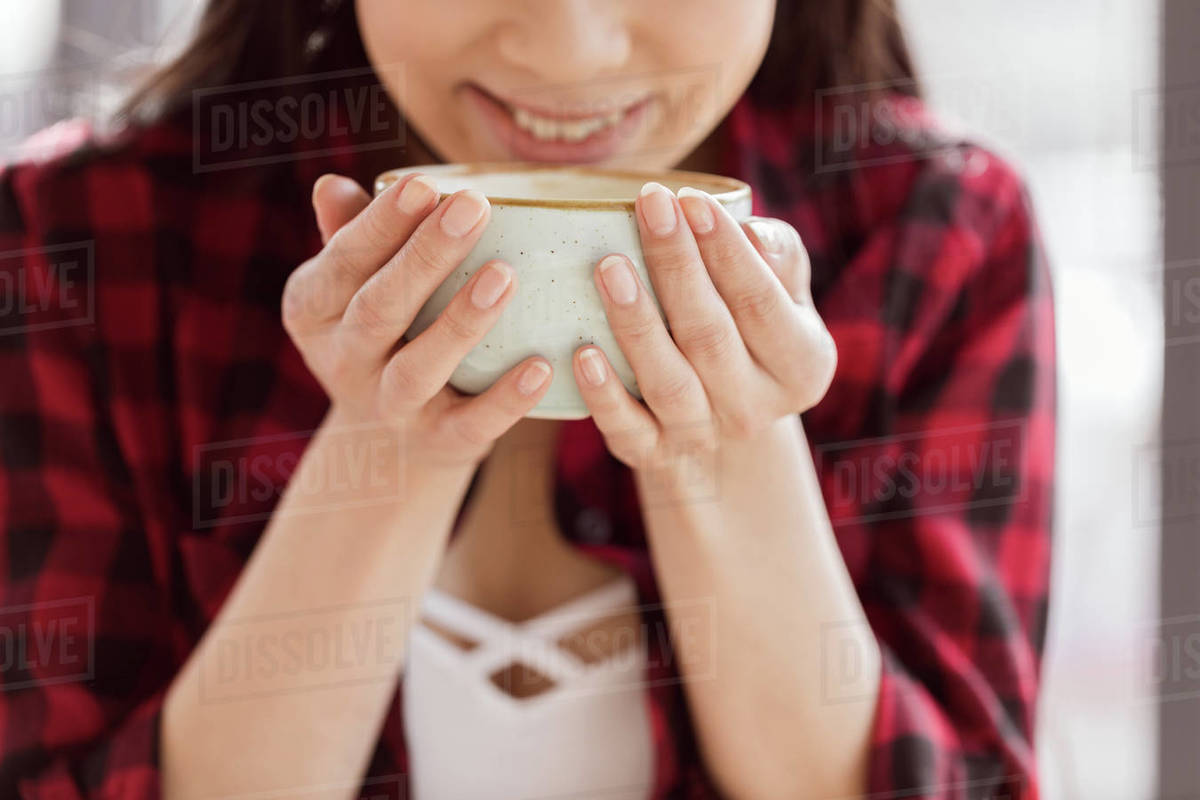 Close up view of woman drinking coffee from big cup - Royalty-free ...