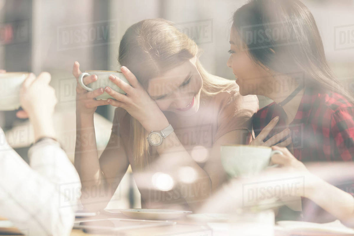 Friends spend time together on coffee break in cafe - Royalty-free ...