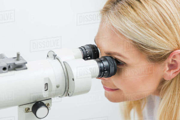 Professional optometrist working with slit lamp in clinic - Stock Photo ...