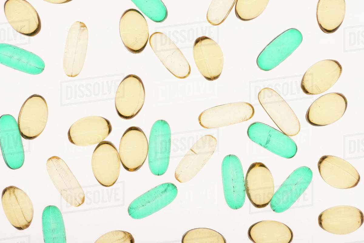 close-up view of various colorful medical capsules on white - Stock ...