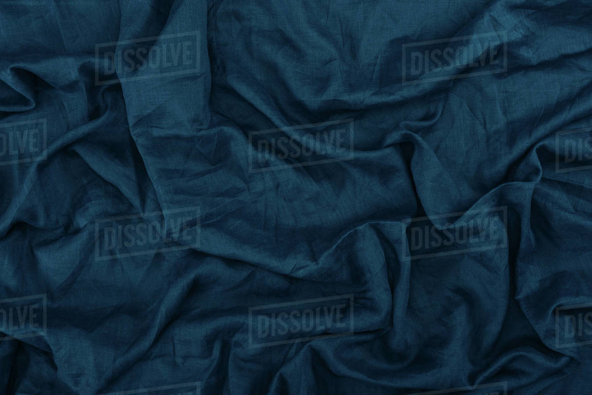 close up view of dark blue linen fabric texture - Stock Photo - Dissolve