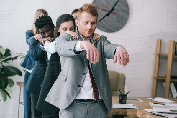 exhausted zombie like businesspeople standing in row at office ...