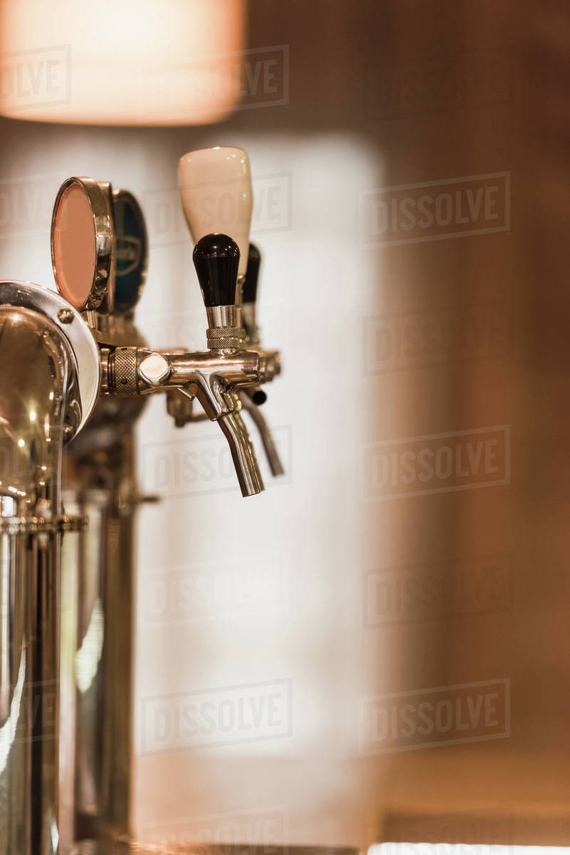Beer taps at bar counter at the restaurant - Royalty-free Stock Photo ...