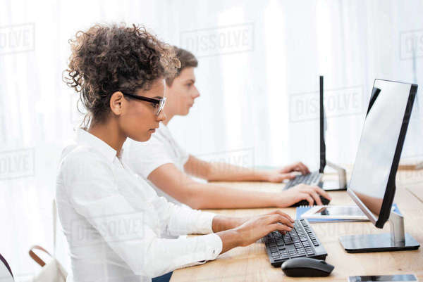Young teenager students working on computers - Royalty-free Stock Photo ...