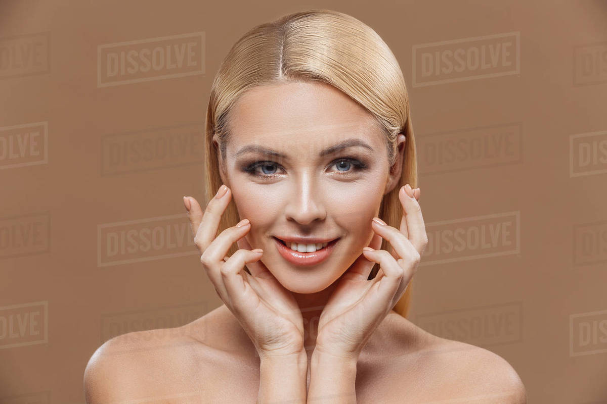 Beautiful Tender Woman With Perfect Skin Isolated On Brown Stock