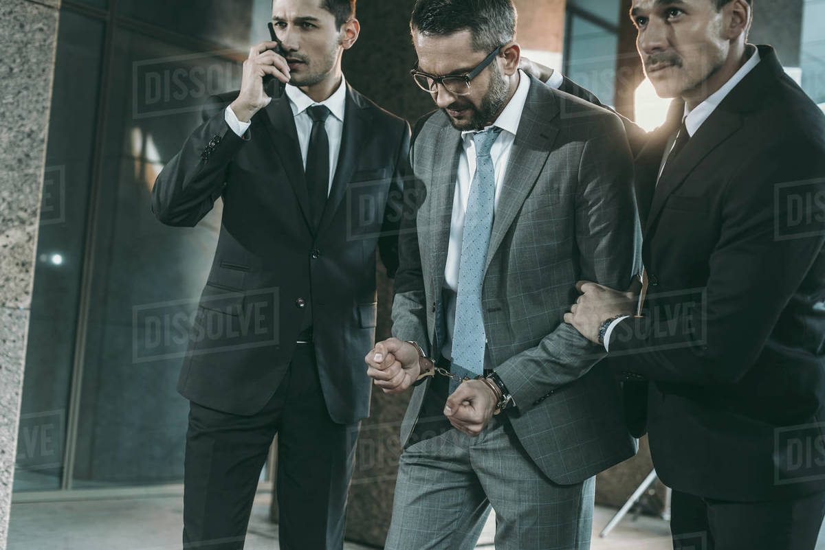 Security guards going with male suspect - Royalty-free Stock Photo ...