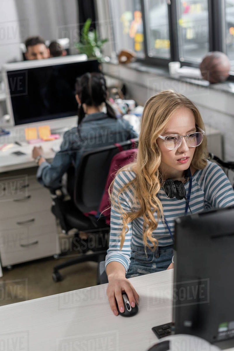 Young people working at modern office - Royalty-free Stock Photo | Dissolve