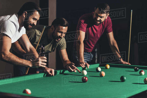 Group of young handsome men playing in pool at bar - Royalty-free Stock ...