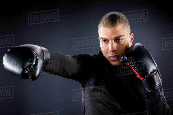 handsome african american boxer making hit on black - Stock Photo ...