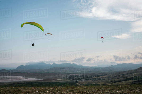 people flying on paraplanes sky with clouds on background - Stock Photo ...