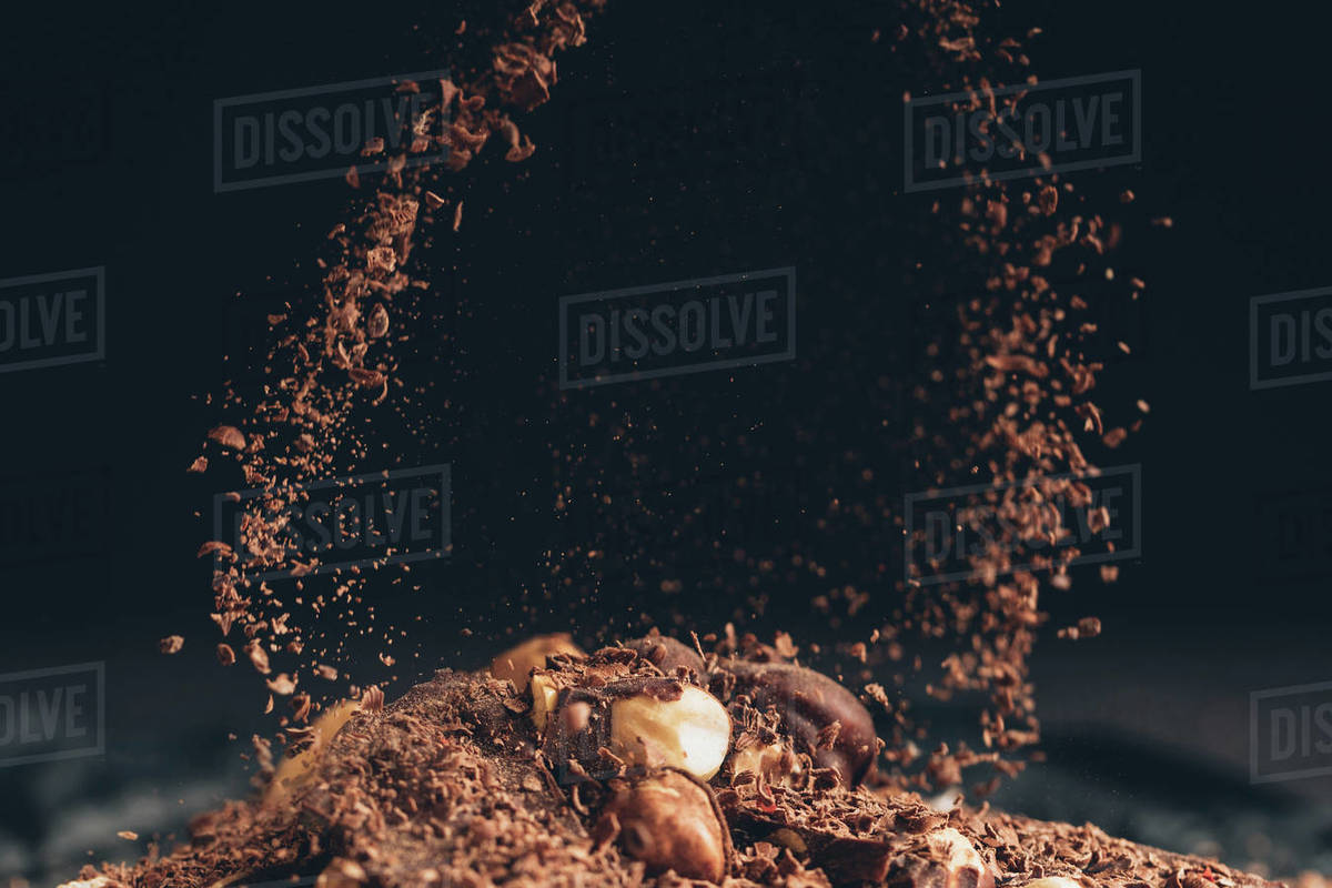 Falling shredded chocolate pieces on a chocolate pile - Royalty-free ...