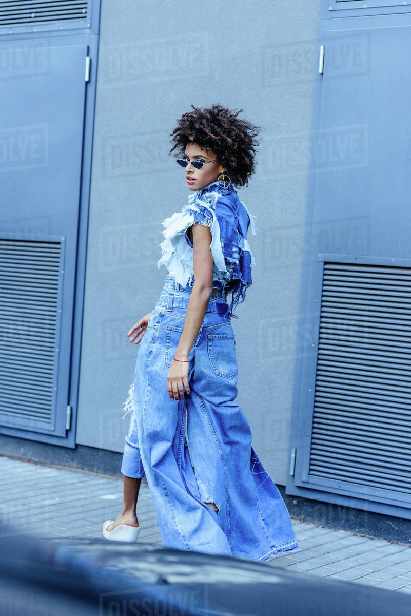 Fashionable African American model posing in denim clothes - Royalty ...
