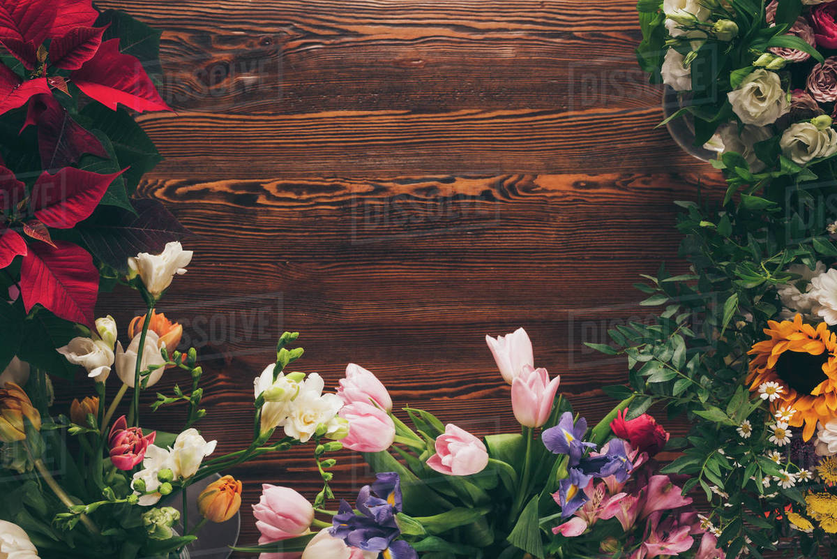 Top view of colored flowers on table in flower shop - Royalty-free ...