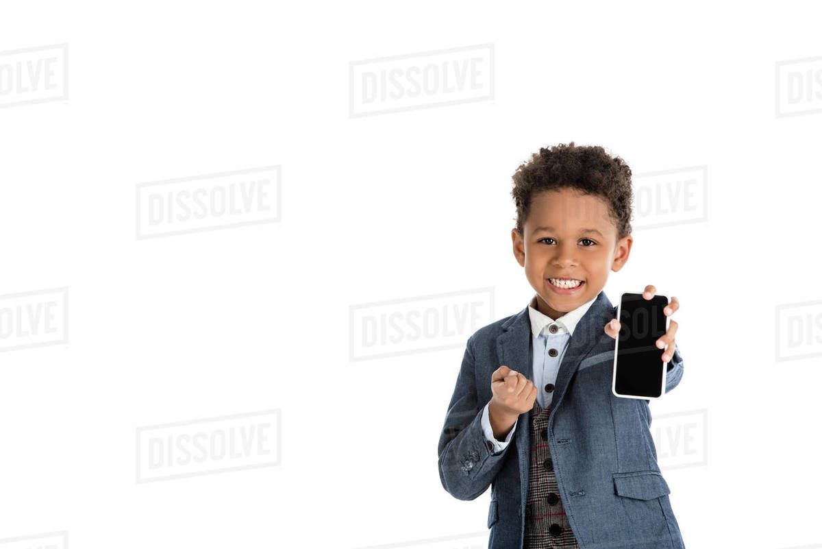 Smiling african american kid showing smartphone isolated on white ...