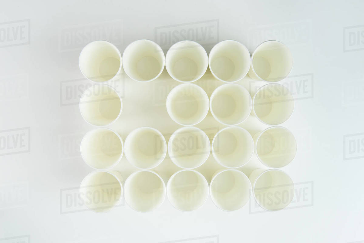 Close-up top view of empty plastic cups isolated on grey - Royalty-free ...