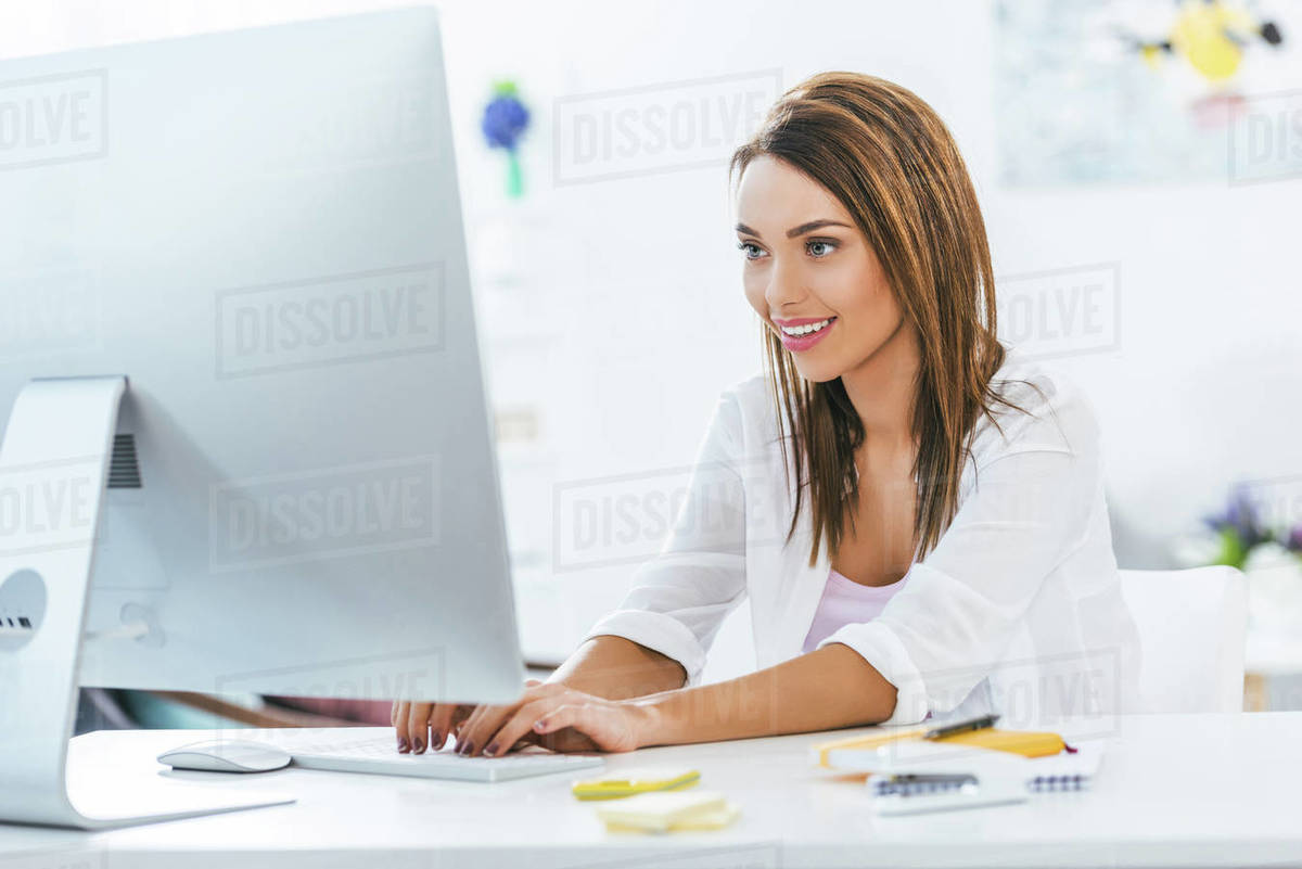Attractive happy girl working with computer at home - Royalty-free ...
