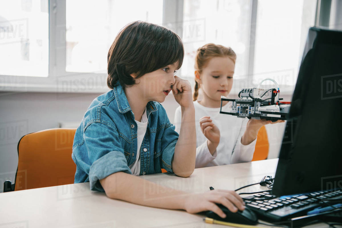 children programming robots together, stem education concept - Royalty ...