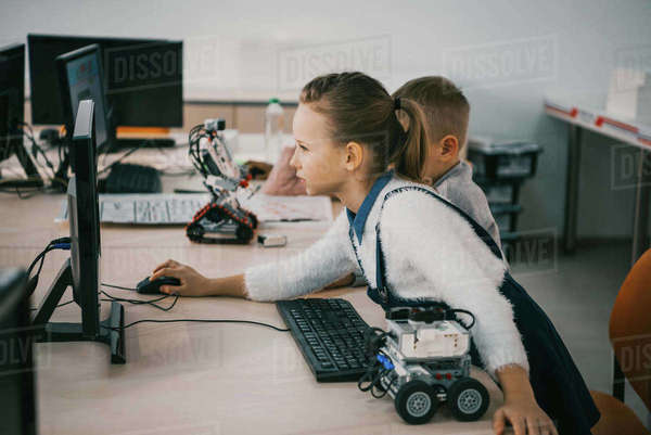 concentrated teen child programming robot at class, stem education ...