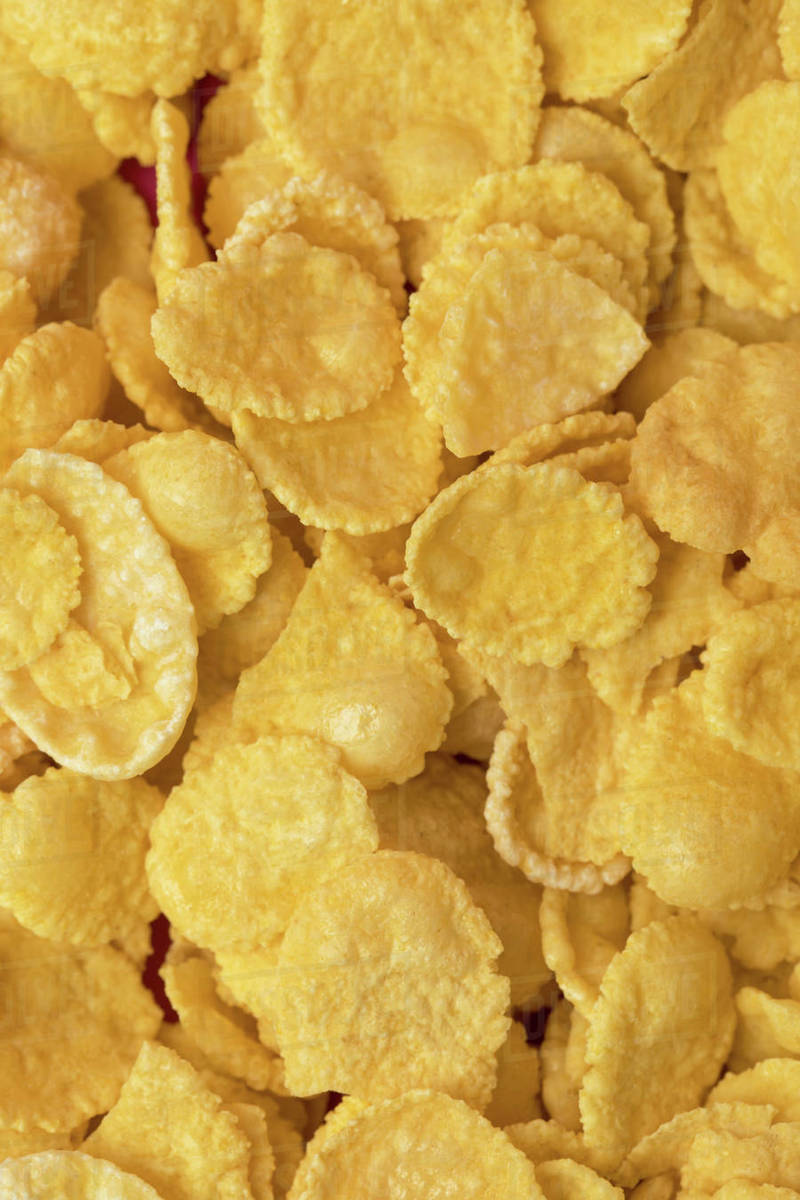 Close-up full frame background from healthy crispy corn flakes ...