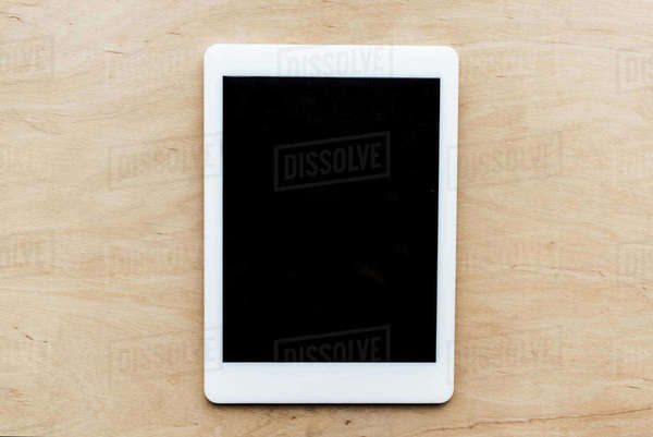 Top view of one turned off tablet on wooden table - Royalty-free Stock ...
