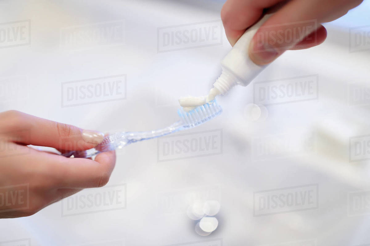 cropped image of boyfriend applying tooth paste on girlfriend tooth ...