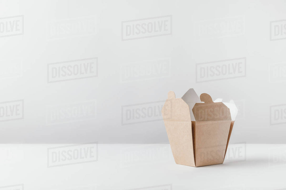 One open noodles box on white surface - Royalty-free Stock Photo | Dissolve