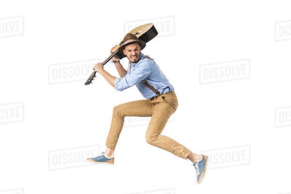 Angry young man ready to hit with guitar isolated on white - Stock ...