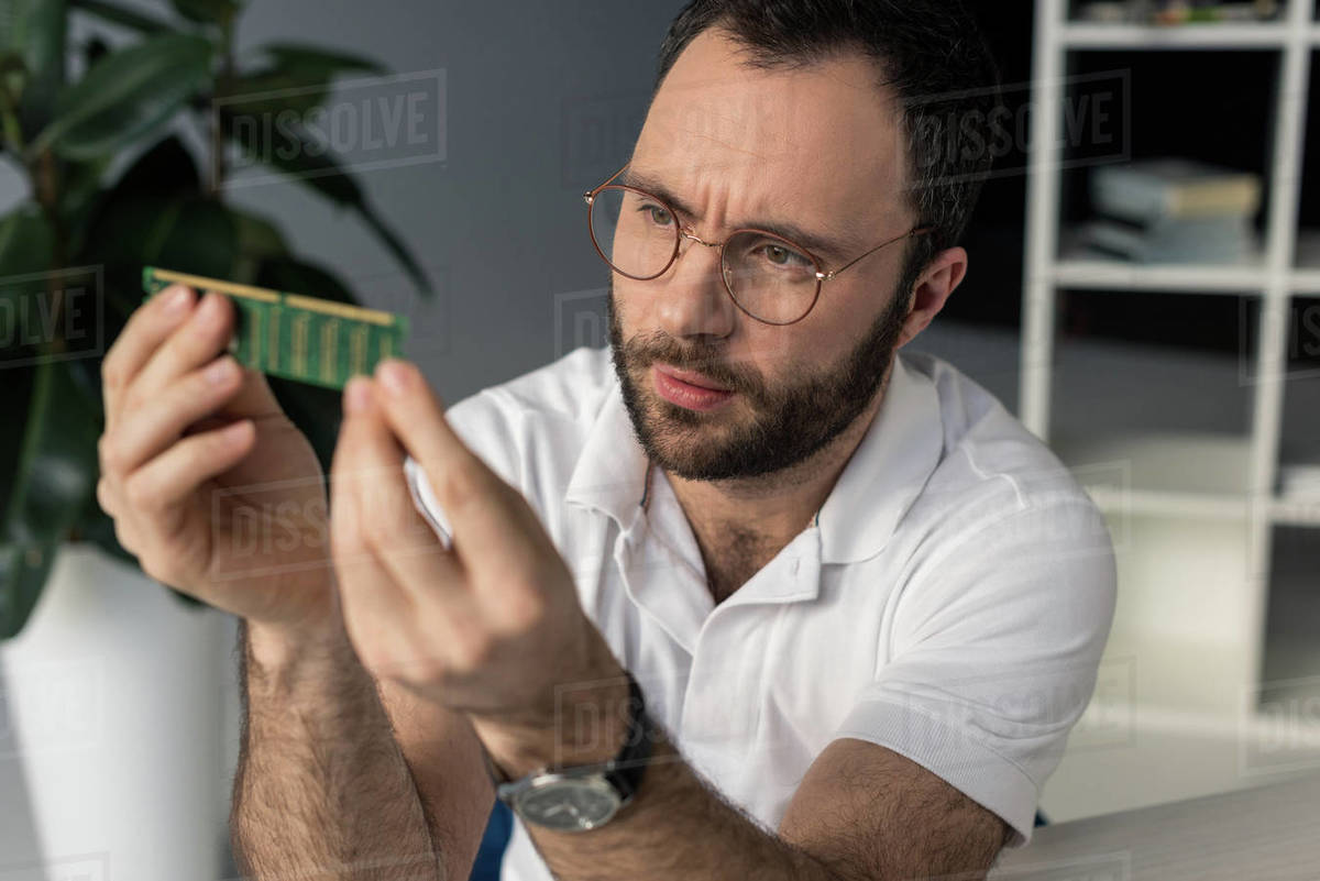 Man looking on ram memory in his hands - Royalty-free Stock Photo ...