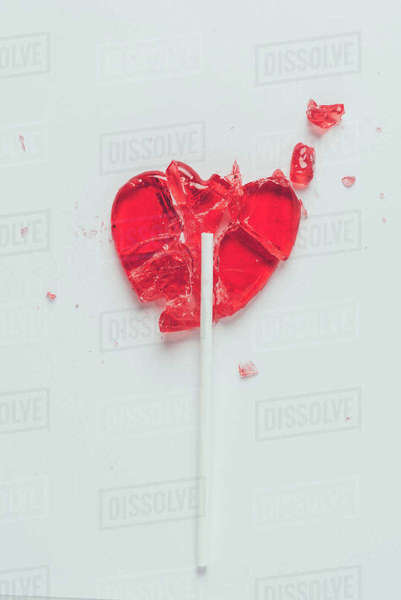 Top view of broken heart shaped lollipop isolated on white - Royalty ...