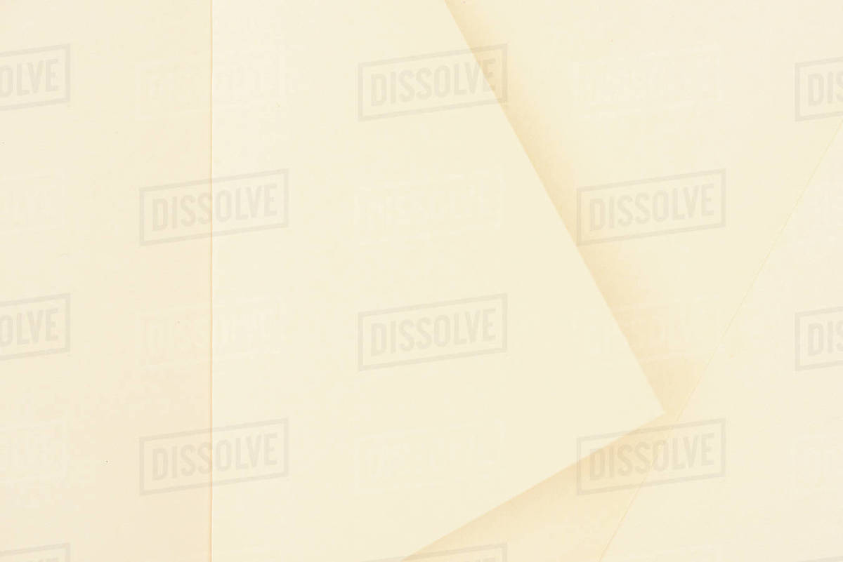 Top view of light beige color paper - Stock Photo - Dissolve