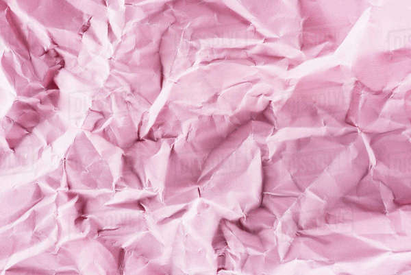 Close-up shot of crumpled pink paper for background - Stock Photo ...