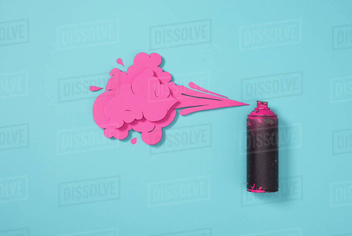 Top view of spray paint in can and paper splashes isolated on blue ...