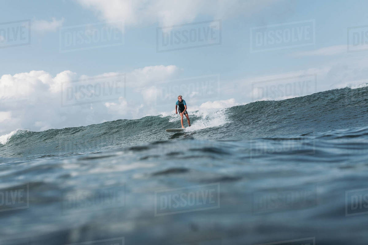 Sportsman surfing wave on surf board in ocean - Royalty-free Stock ...