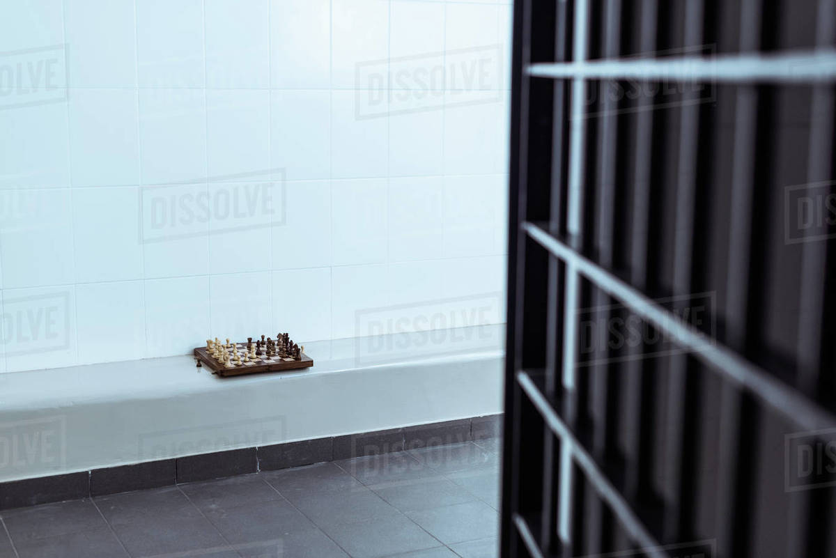 empty prison cell with chessboard on bench - Royalty-free Stock Photo ...